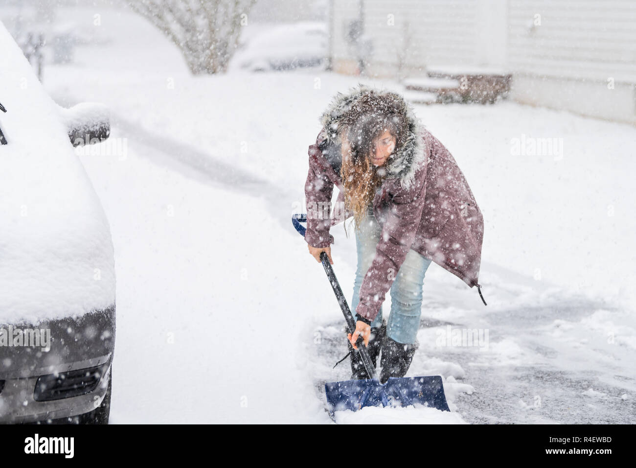 Woman shovel snow hi-res stock photography and images - Alamy