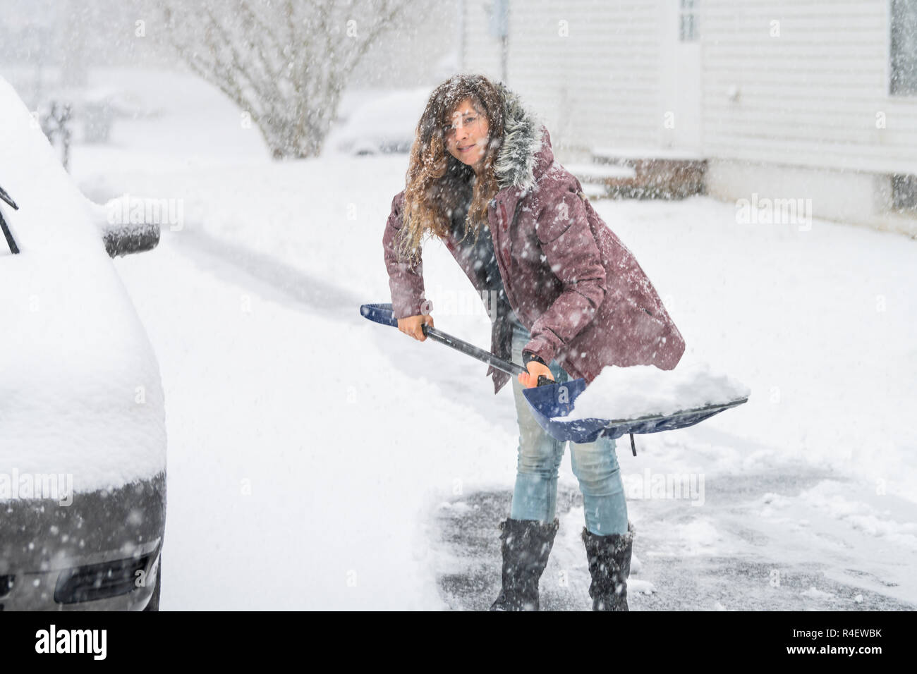 Woman shovel snow hi-res stock photography and images - Alamy