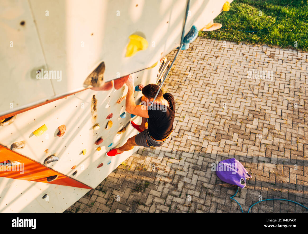 Active lifestyle and bouldering climbing, reaching the top concept ...