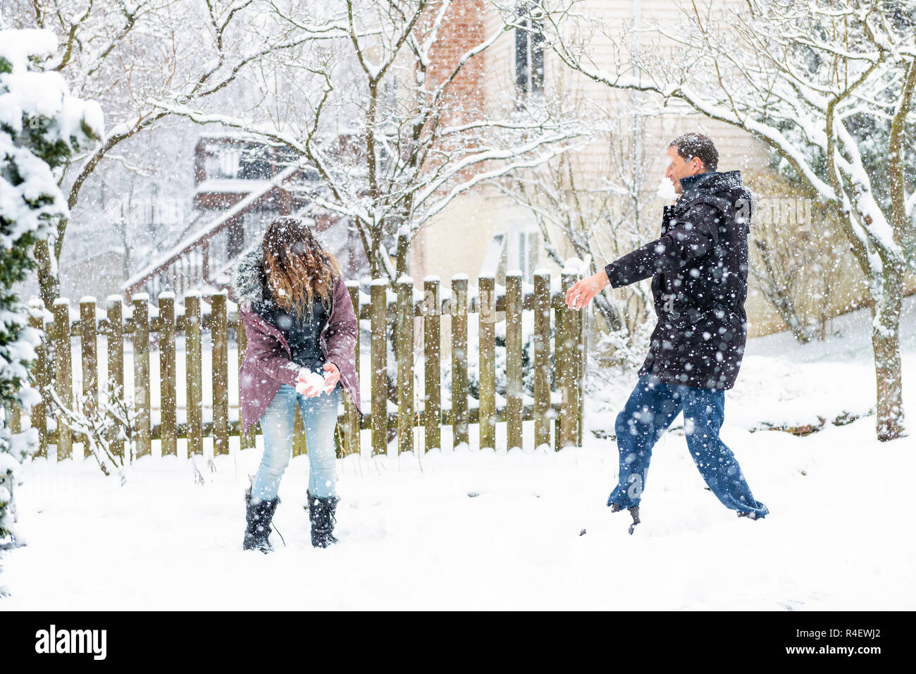 Man woman playing snowballs in hi-res stock photography and images - Alamy