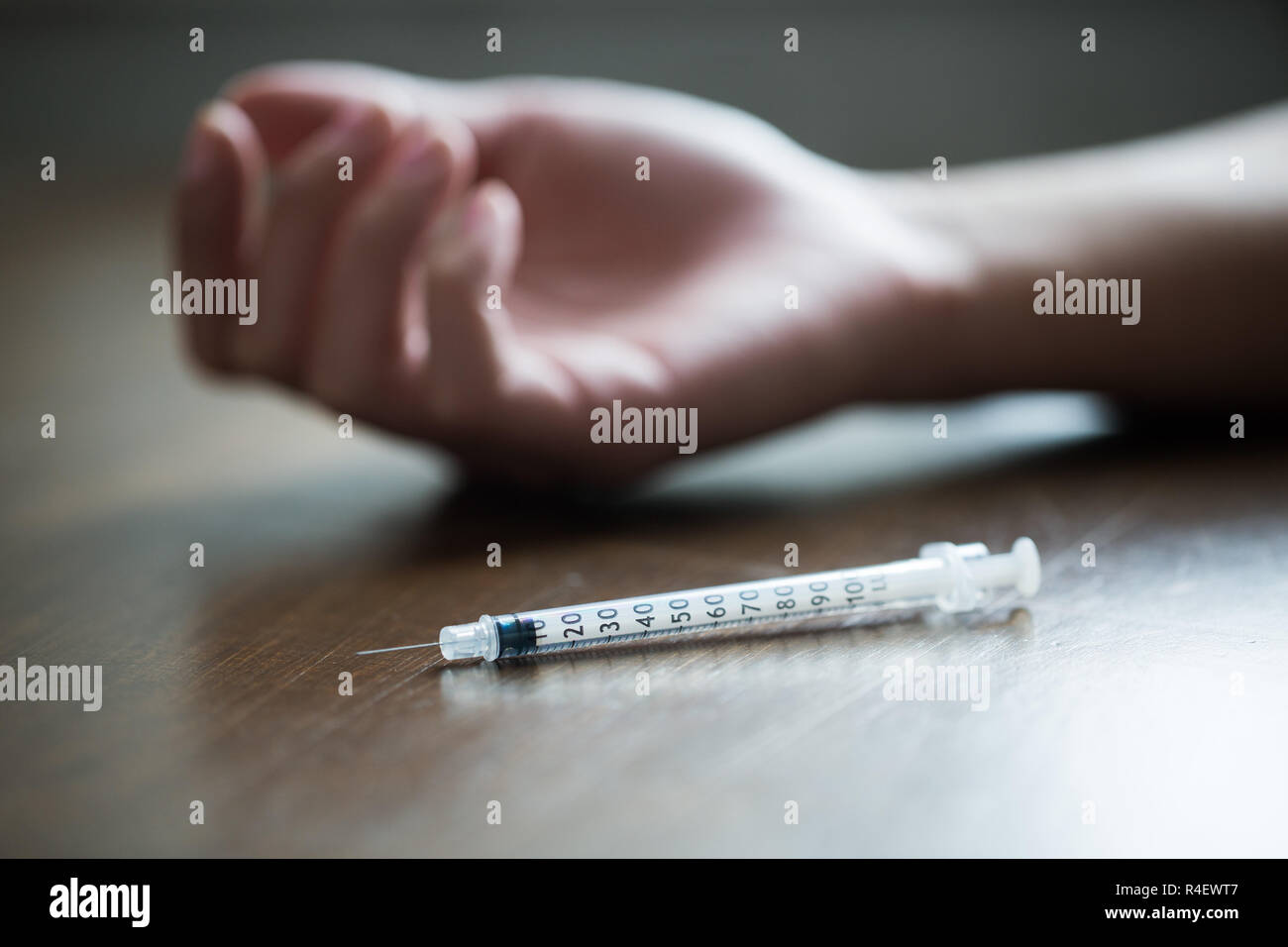 close up of addict hand and used drug syringe Stock Photo - Alamy