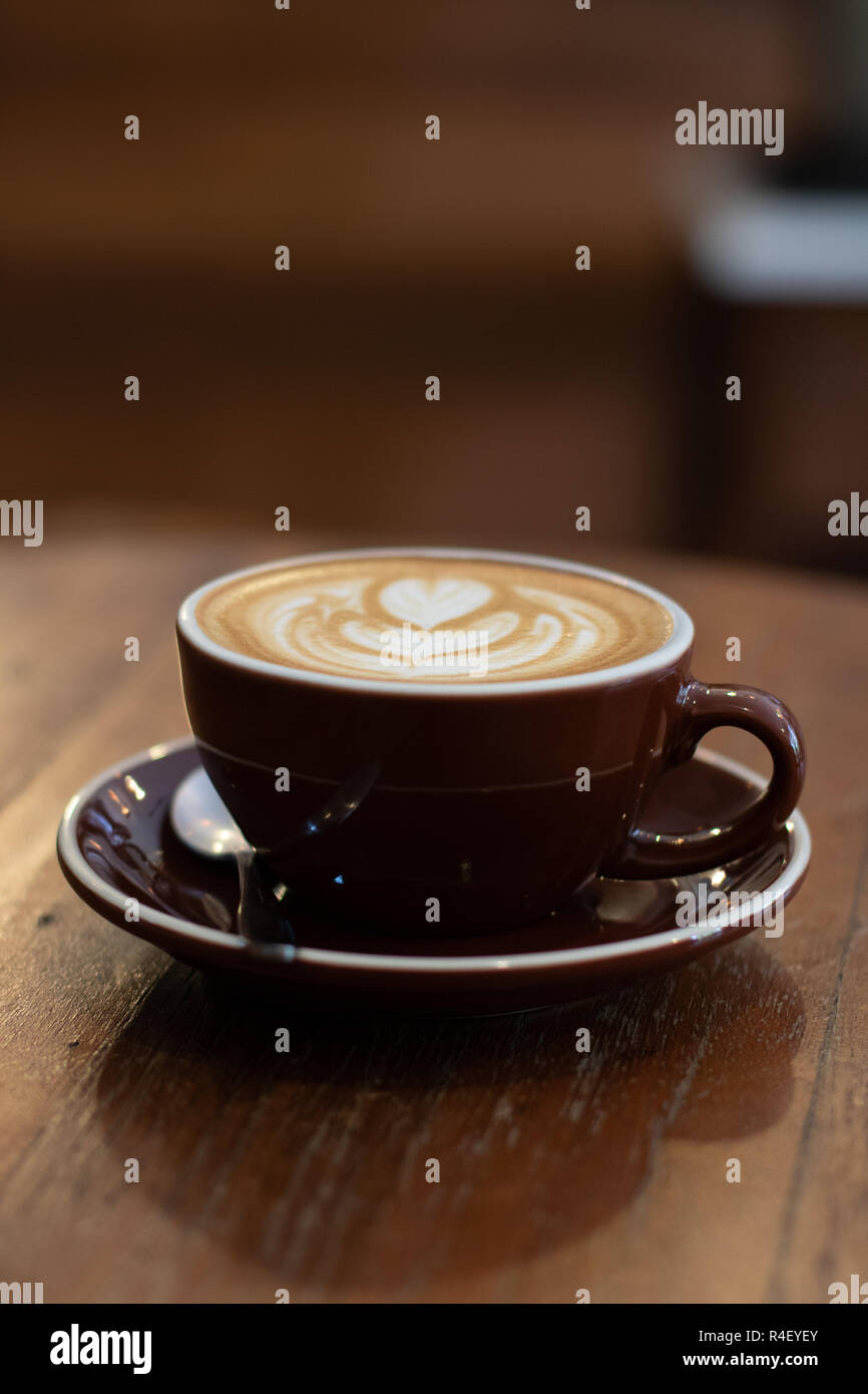 Hot coffee latte with beautiful milk foam art on ceramic glass Stock ...