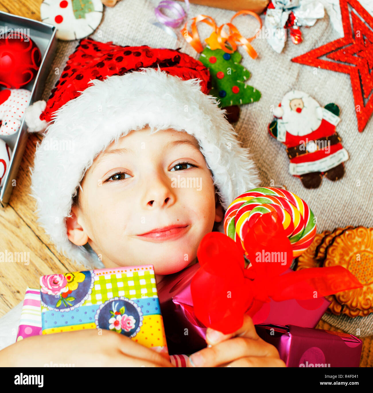little cute boy with Christmas gifts at home. close up emotional Stock ...
