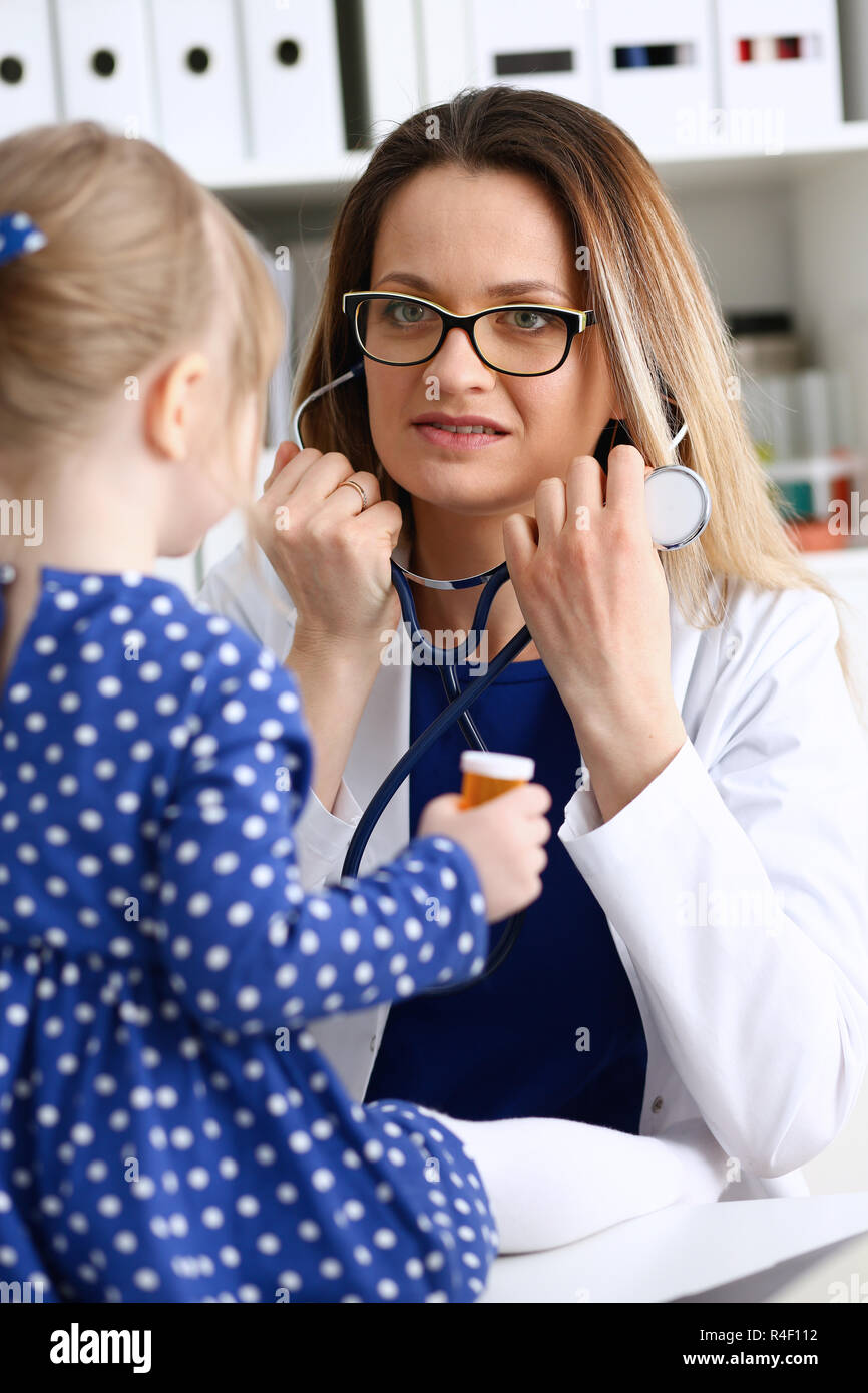 Little child with stethoscope at doctor reception Stock Photo - Alamy