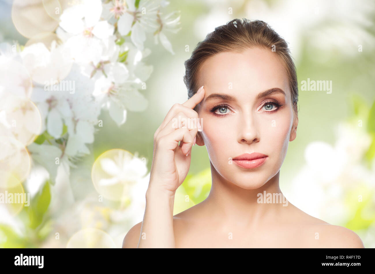 Beautiful woman pointing forehead hi-res stock photography and images ...