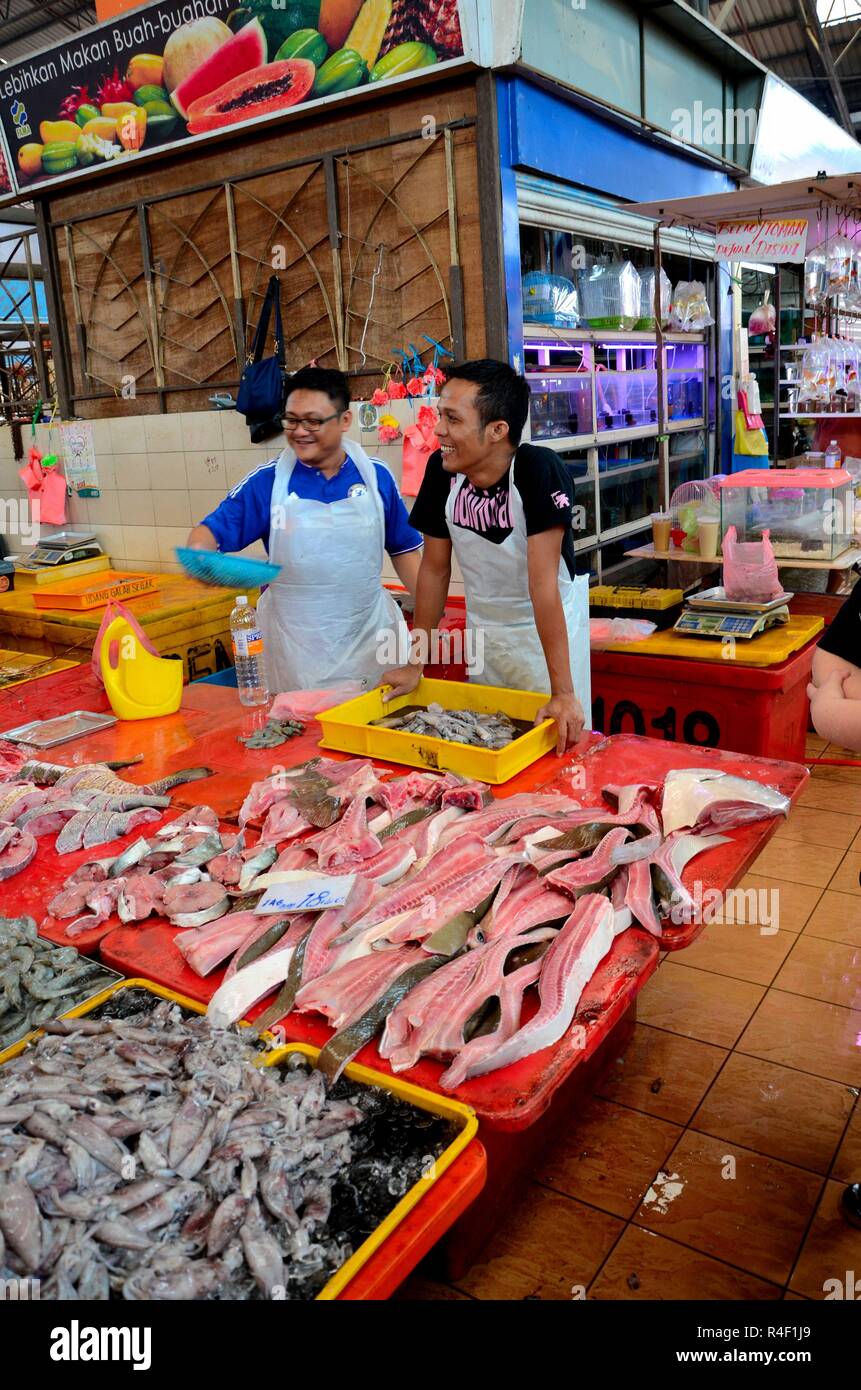 Cheerful stall holders selling fish and seafood Satok Weekend Market ...