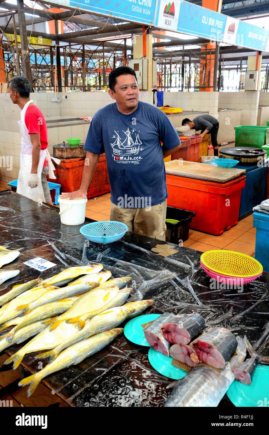 Malay man sells fresh fish at Satok Weekend Market shop Kuching Sarawak ...