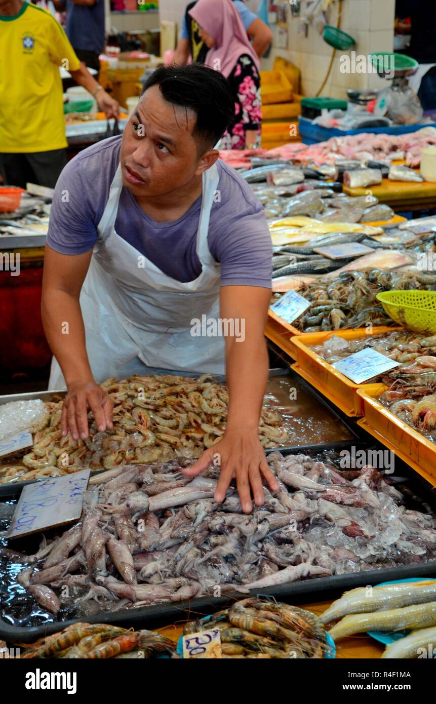 Malaysian fresh seafood fish seller at stall Satok Weekend Market ...