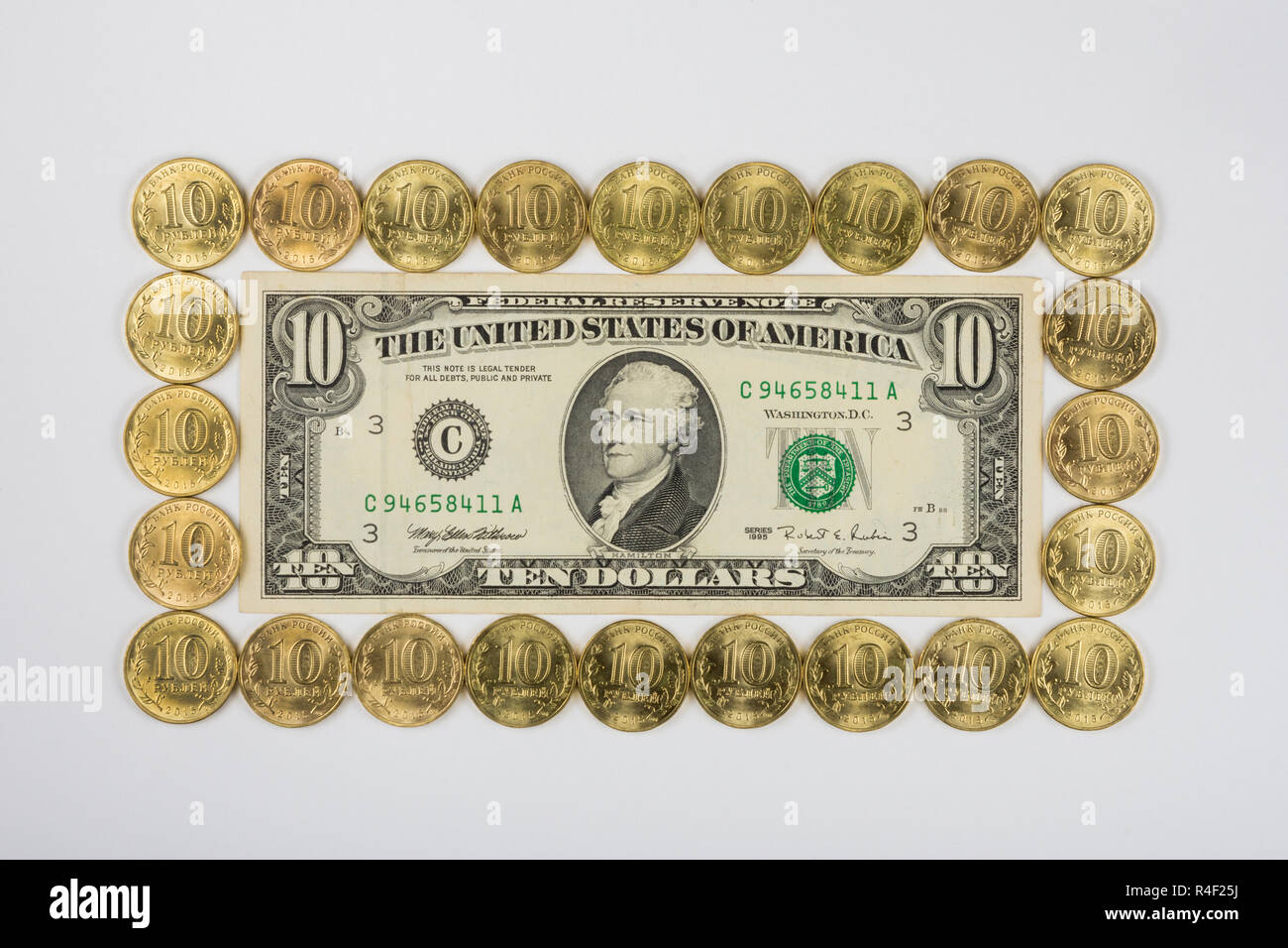 Ten dollars levied on the perimeter of a ten Russian coins, top view ...