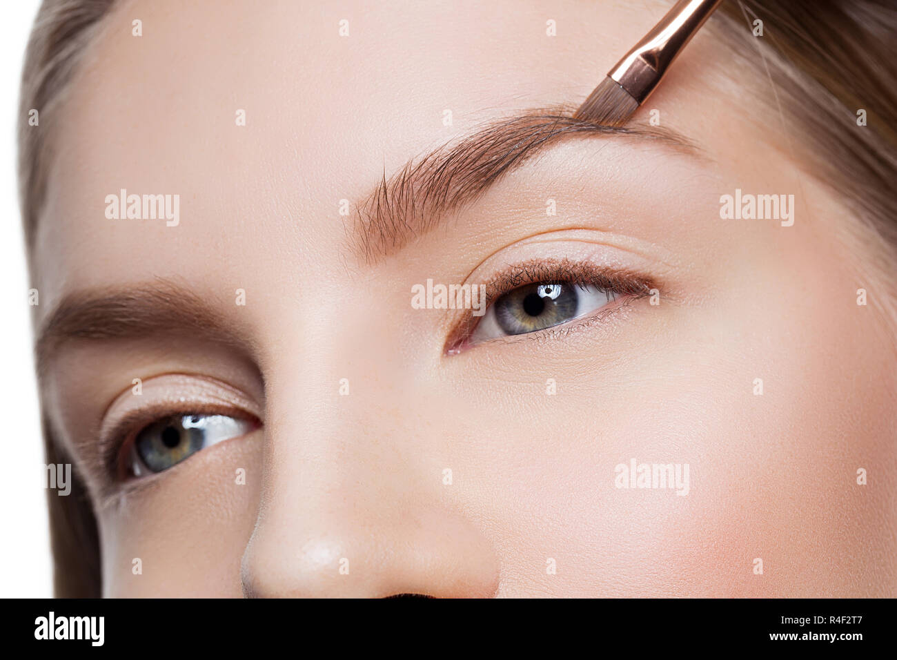 Woman correcting eyebrows form Stock Photo - Alamy