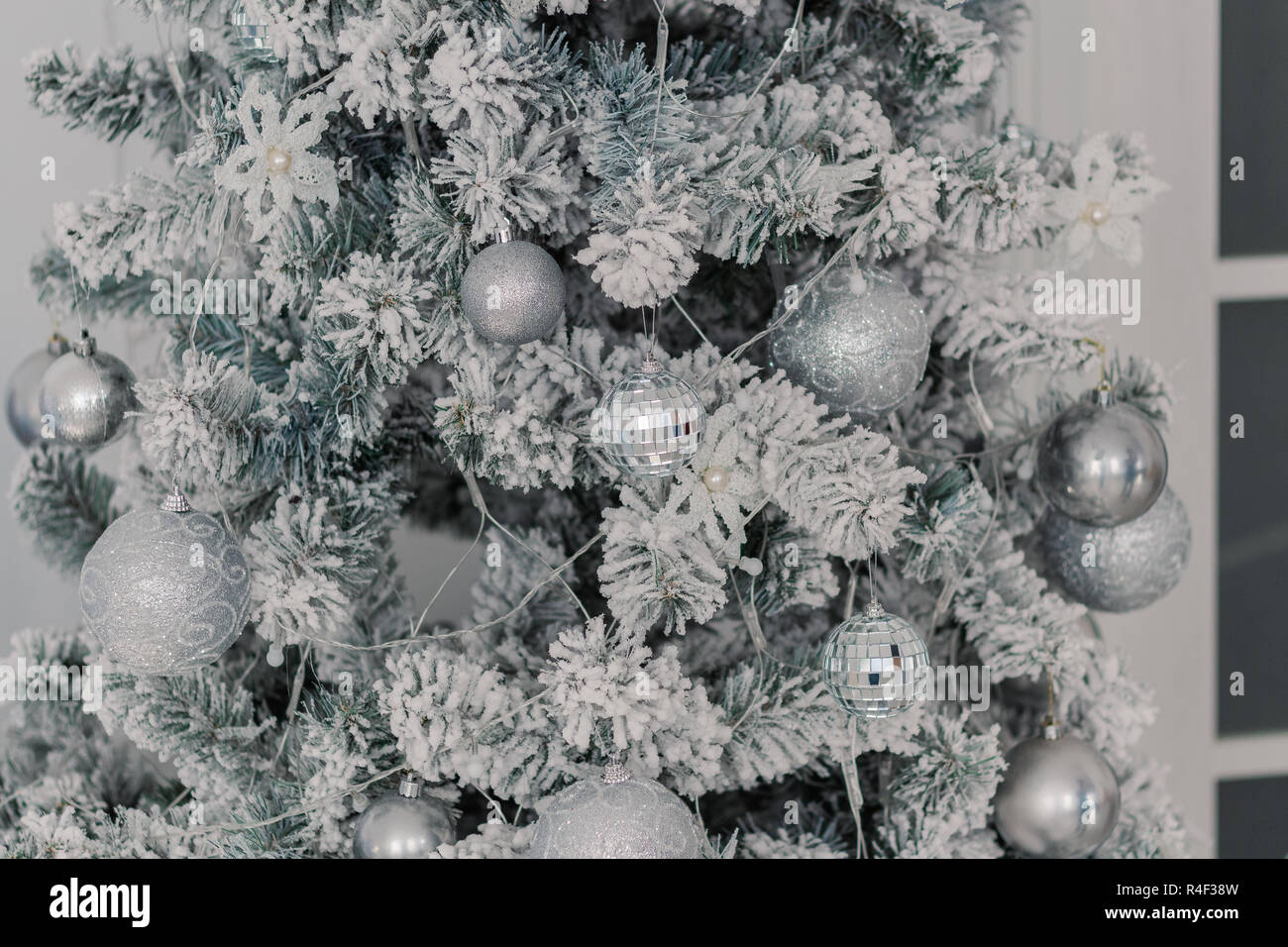 Christmas decorations on a silver Christmas tree Stock Photo - Alamy