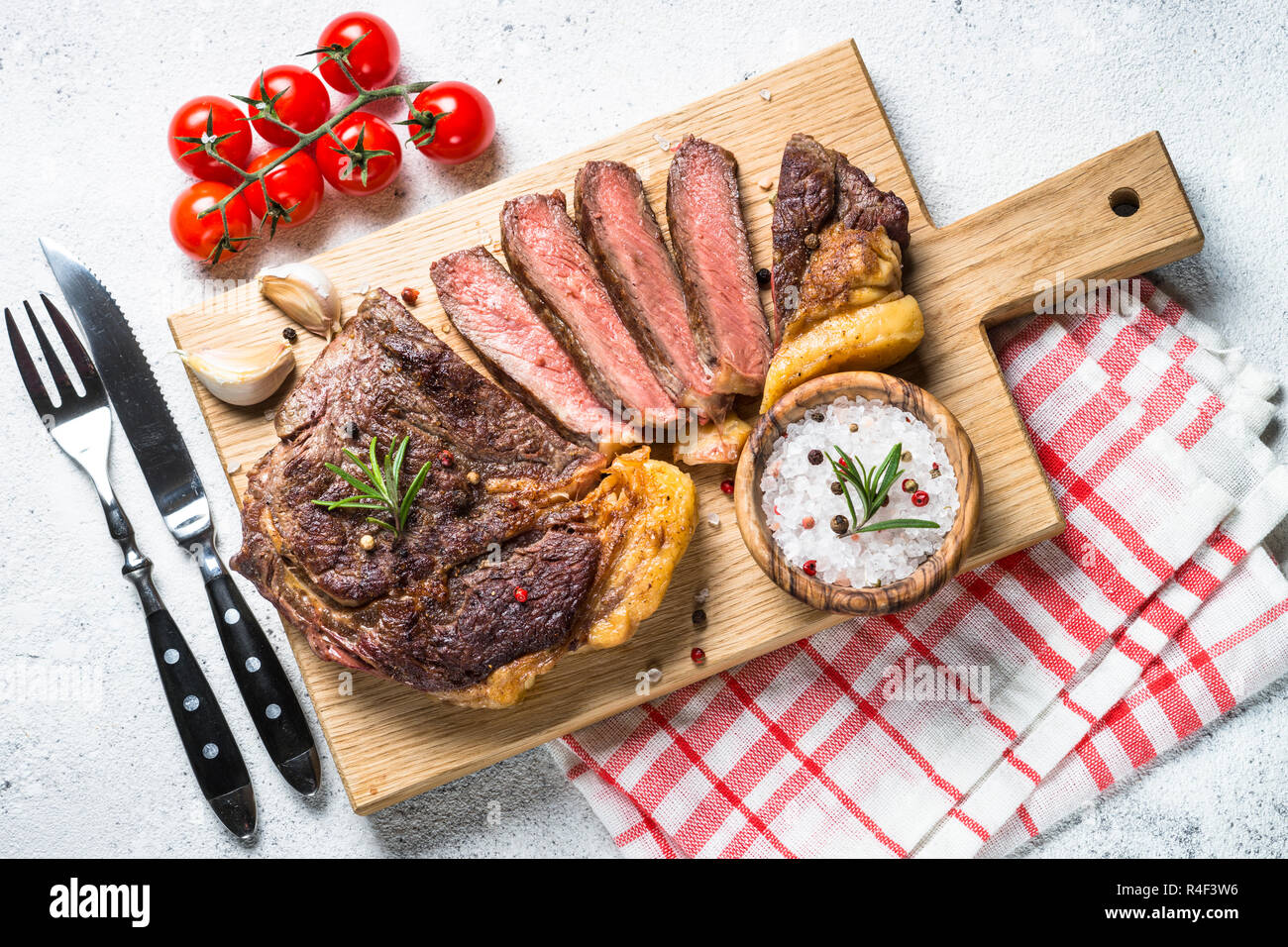 Grilled beef steak ribeye on white Stock Photo - Alamy