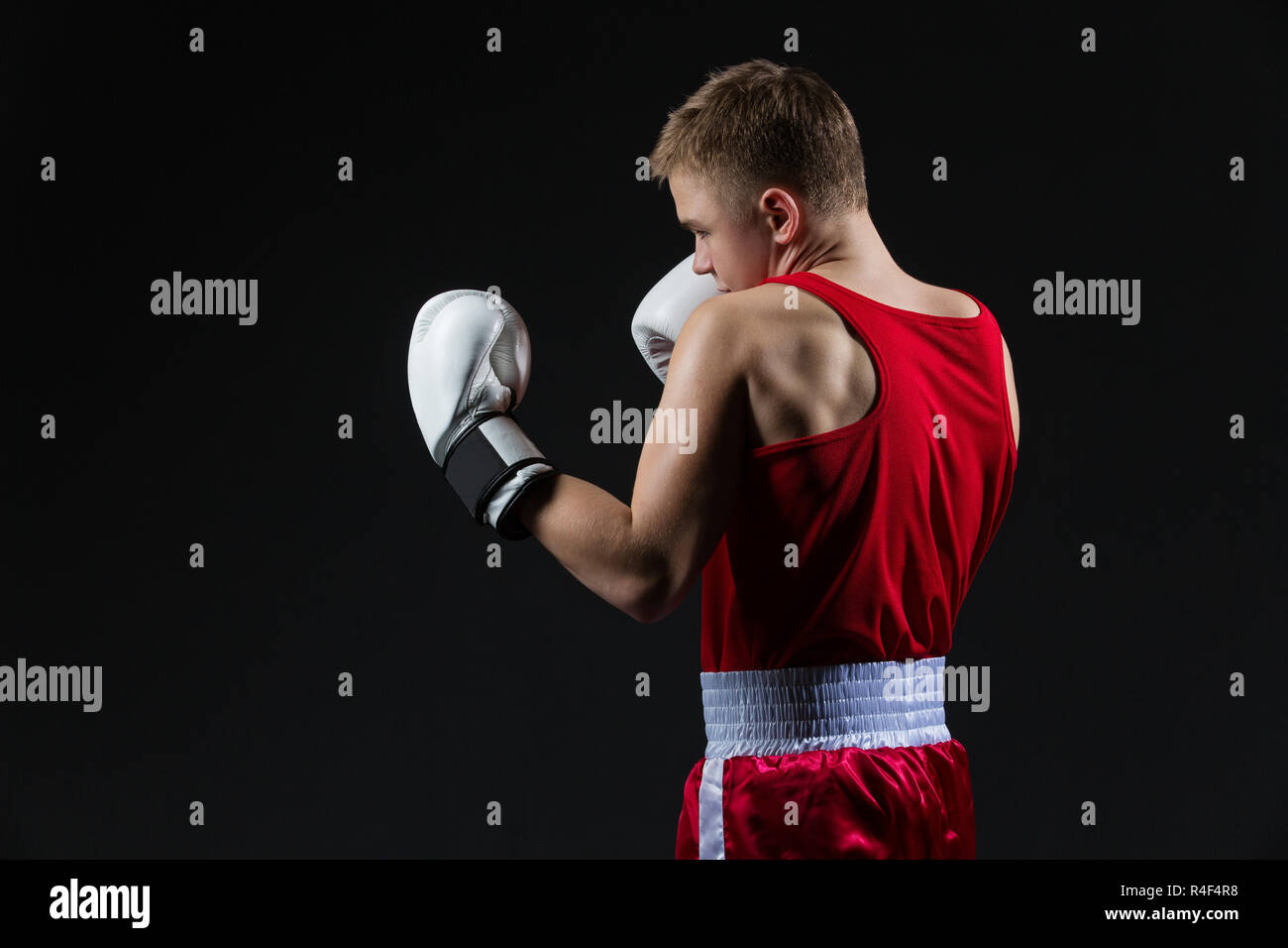 Young boxer in red form Stock Photo - Alamy