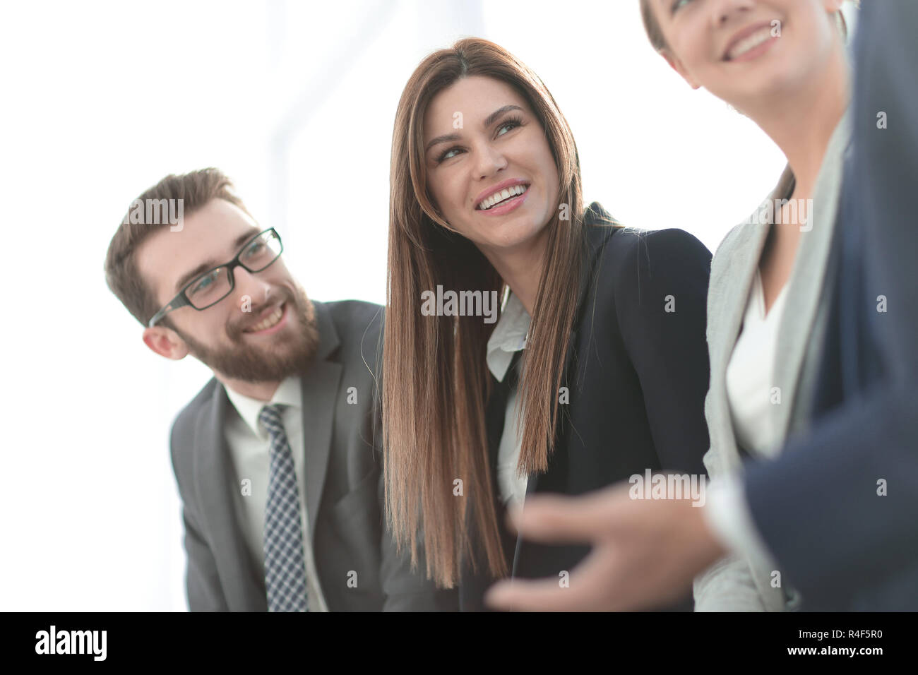 close up.successful employees listen to their boss Stock Photo - Alamy