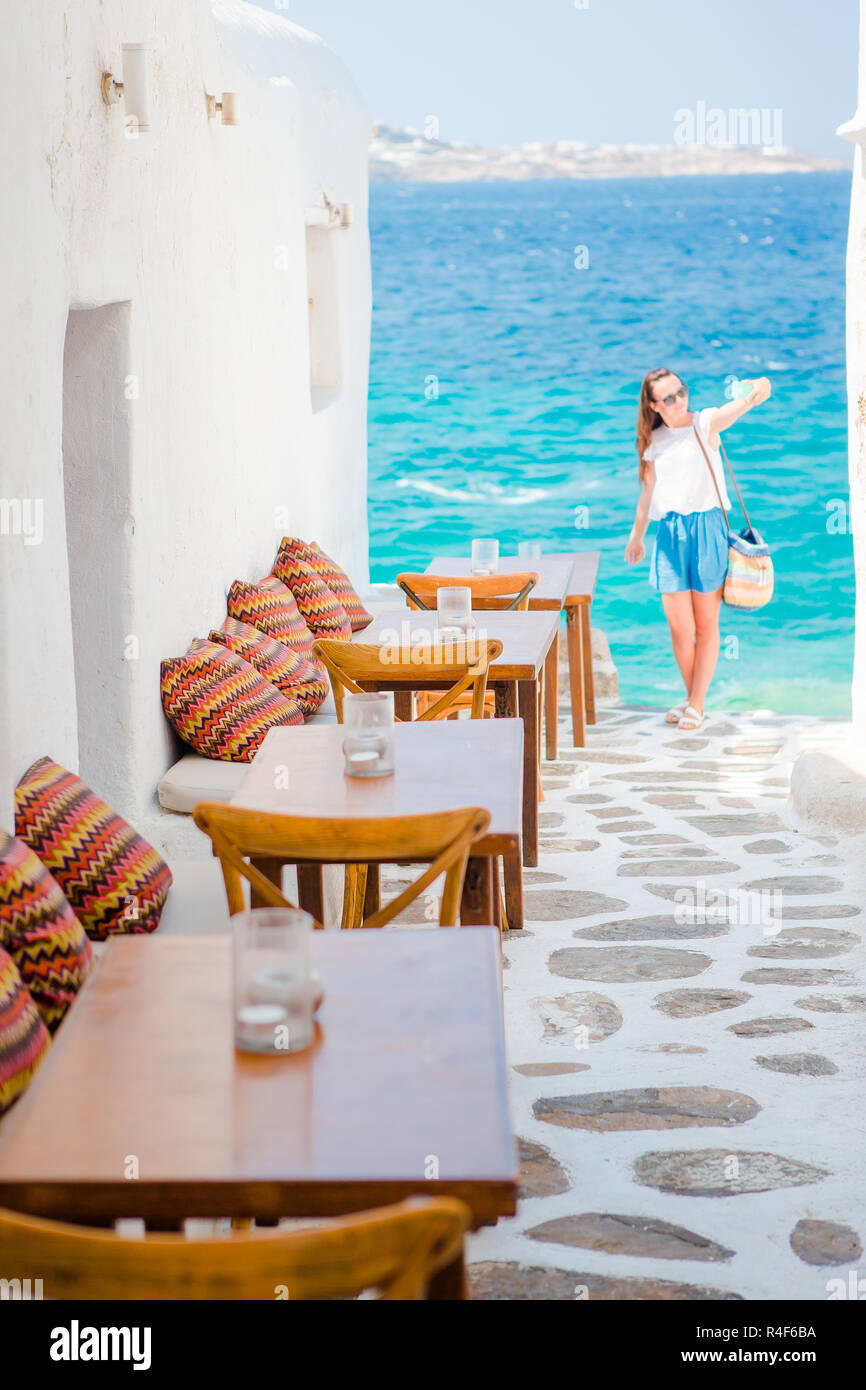Outdoor cafe in a typical greek outdoor cafe in Mykonos with amazing ...