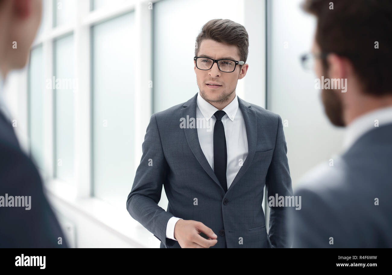 boss and staff standing in the office Stock Photo - Alamy