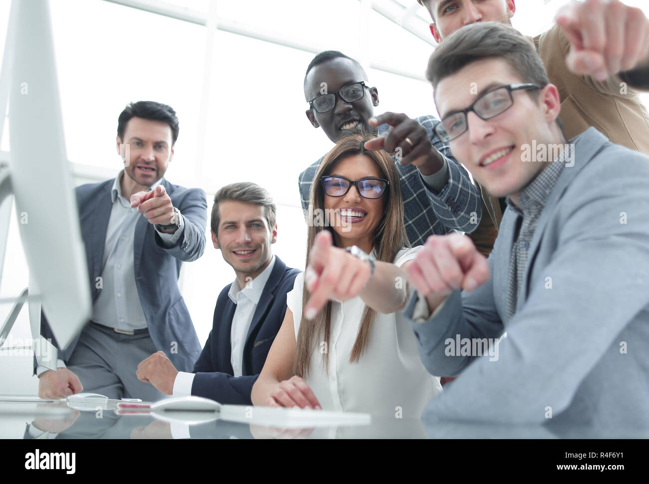 happy business team pointing at you Stock Photo - Alamy