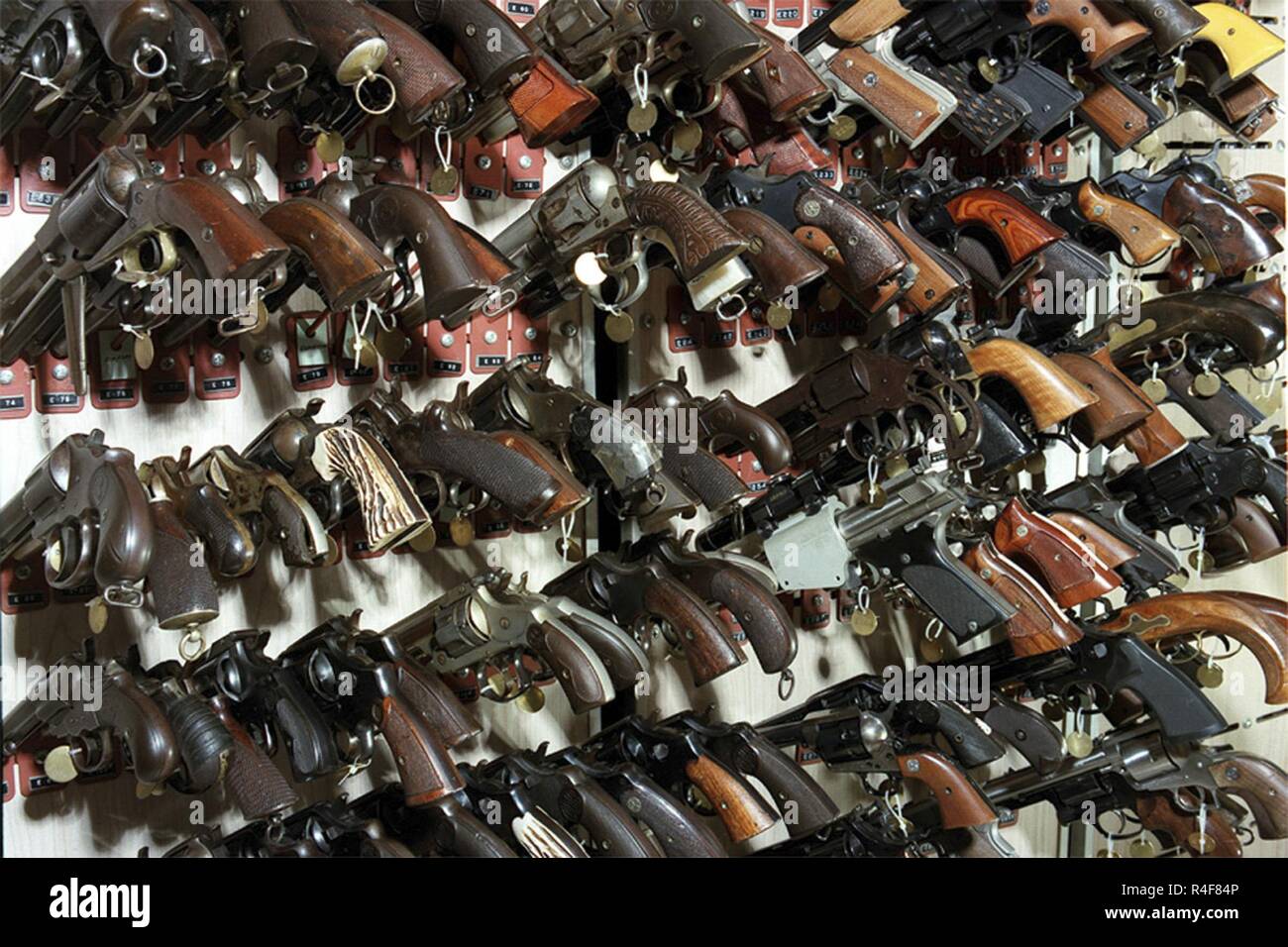 Law enforcement confiscated handguns in a police evidence room Stock ...