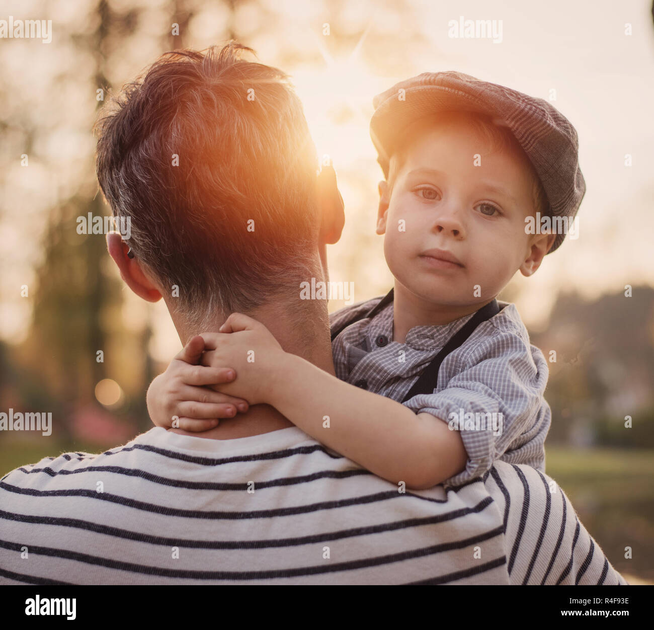 Beautiful portrait of a cute little boy hugging his father Stock Photo ...