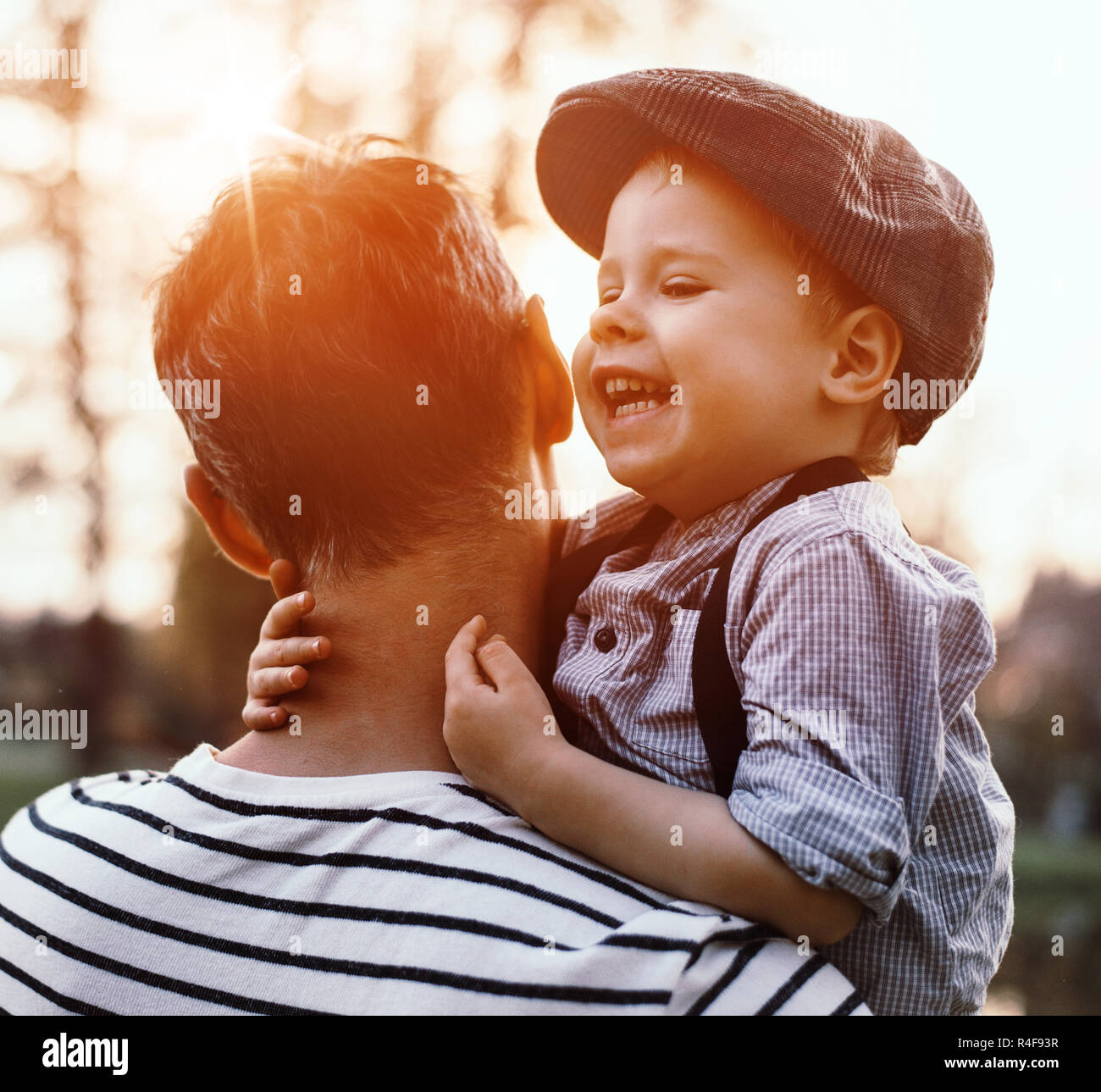 Beautiful portrait of a cute little boy hugging his father Stock Photo ...