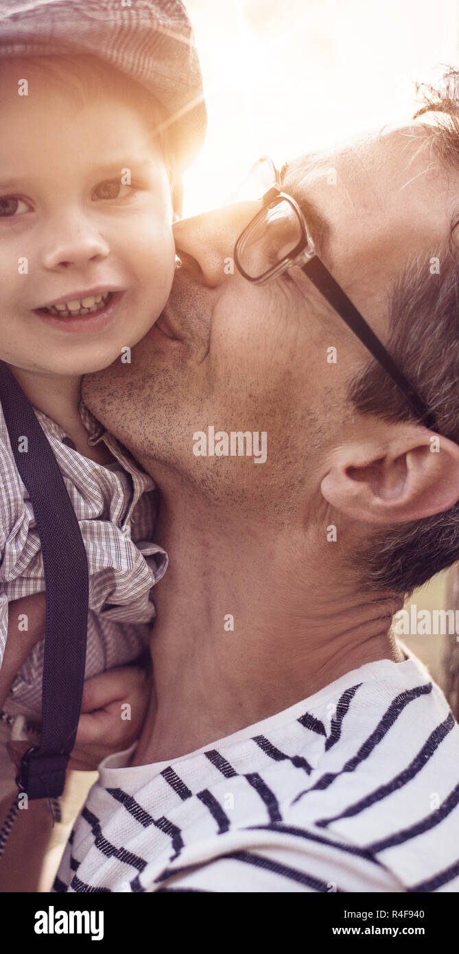 Beautiful portrait of a cute little boy hugging his father Stock Photo ...