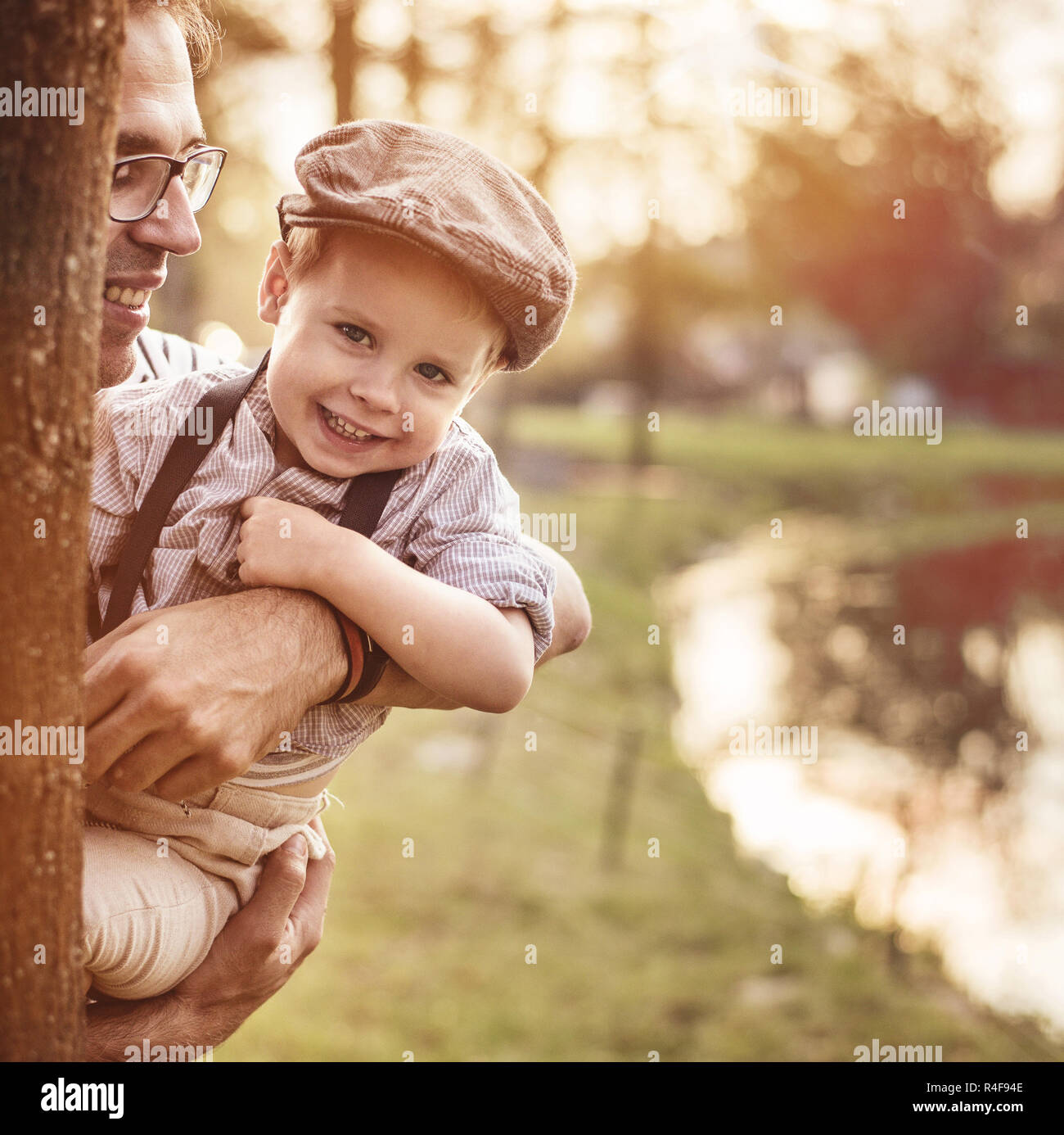 Beautiful portrait of a cute little boy hugging his father Stock Photo ...