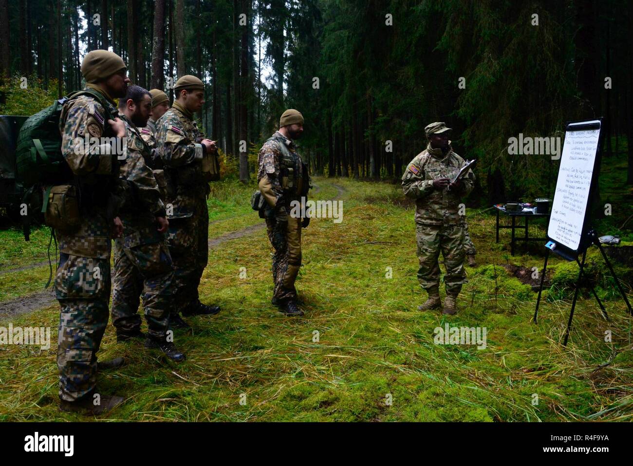 U.S. Army Sgt. Stephen Domfe (right), assigned to the 2nd Signal ...