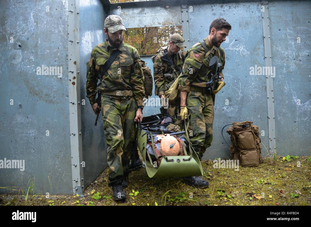 Norwegian soldiers work together to complete the Casualty Evacuation ...