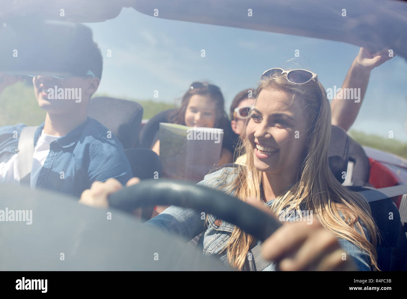 happy friends driving in cabriolet car Stock Photo - Alamy