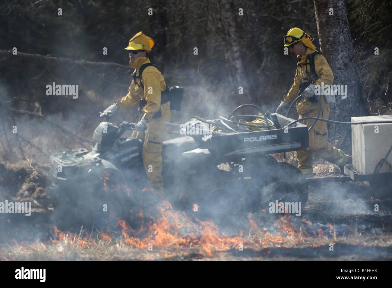 Firefighting personnel, assigned to the 673d Civil Engineer Squadron ...