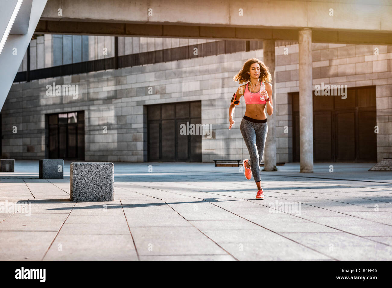 Athletic woman running hi-res stock photography and images - Alamy