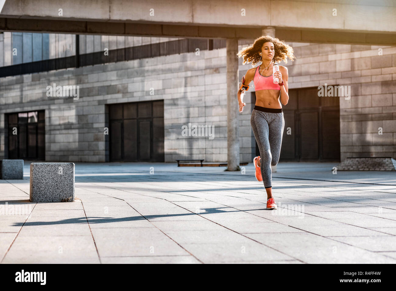 Skinny attractive woman having a morning run Stock Photo - Alamy