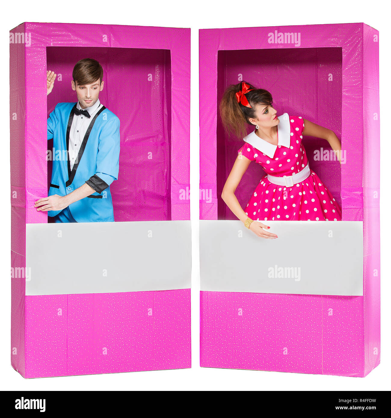Boy and girl looking like dolls in boxes Stock Photo - Alamy