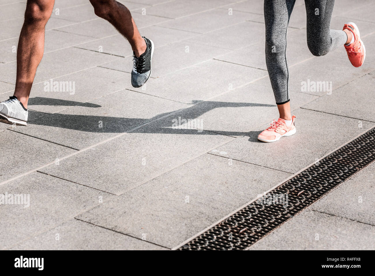 Legs of nice professional athletes during the run Stock Photo - Alamy