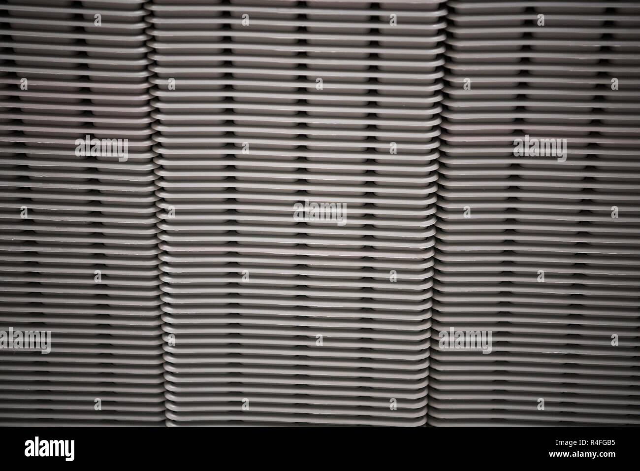 Grey plastic home containers tower at store Stock Photo - Alamy