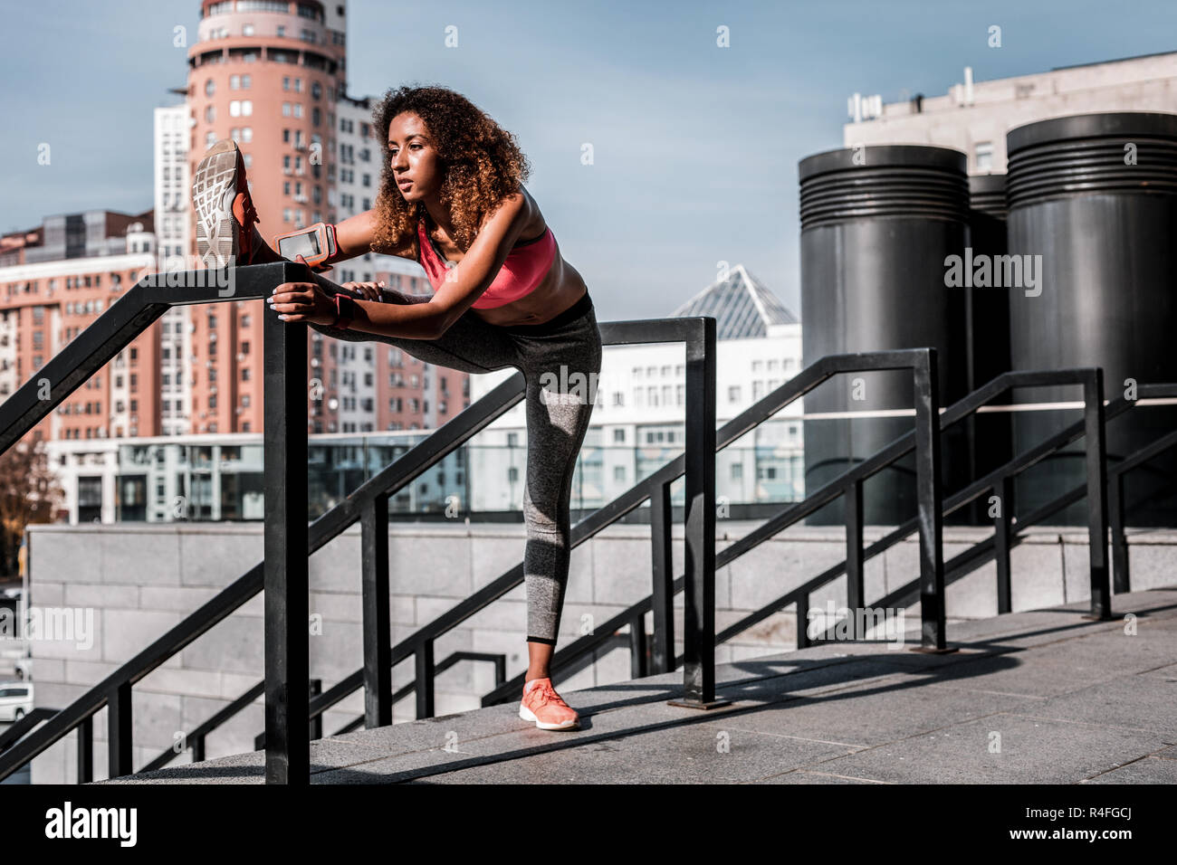 Beautiful skinny young woman developing her flexibility Stock Photo - Alamy