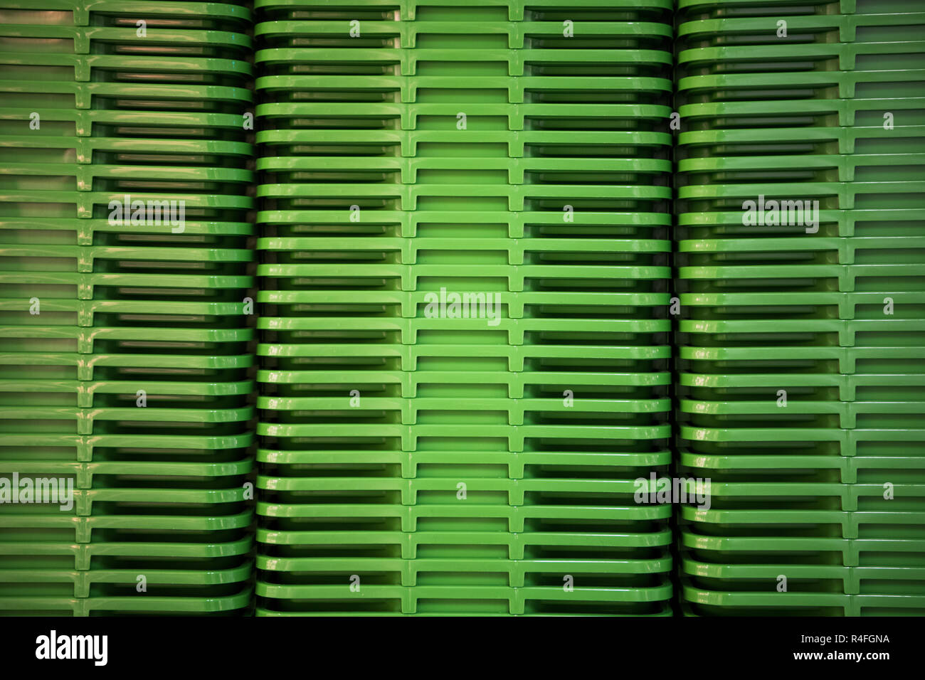 folded green plastic containers at store Stock Photo - Alamy