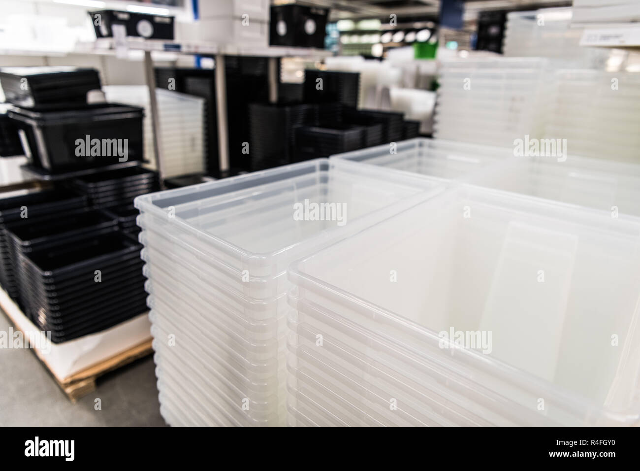 Transparent and black plastic containers stack in a store Stock Photo ...