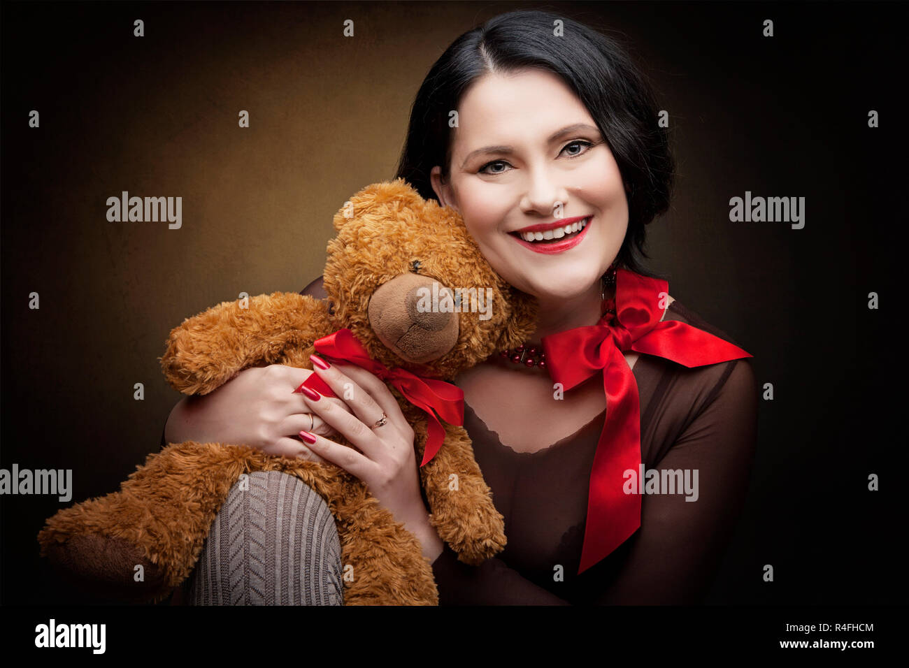 Woman with teddy bear Stock Photo - Alamy