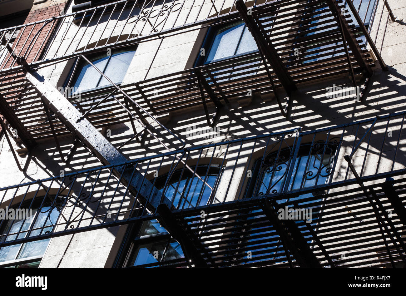 Metal fire escape outside New York block Stock Photo - Alamy