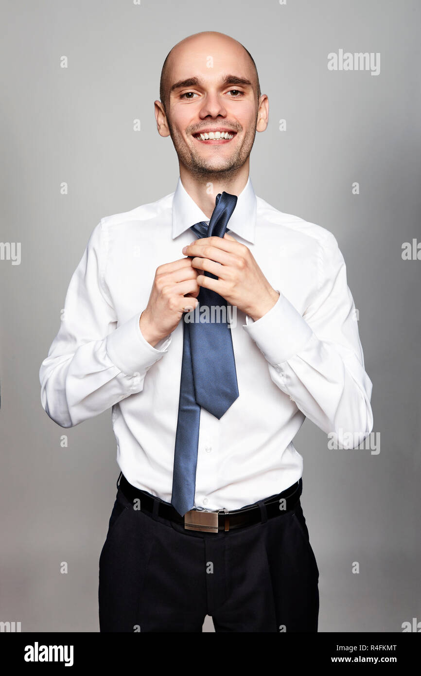 Man Tying a Tie Stock Photo - Alamy