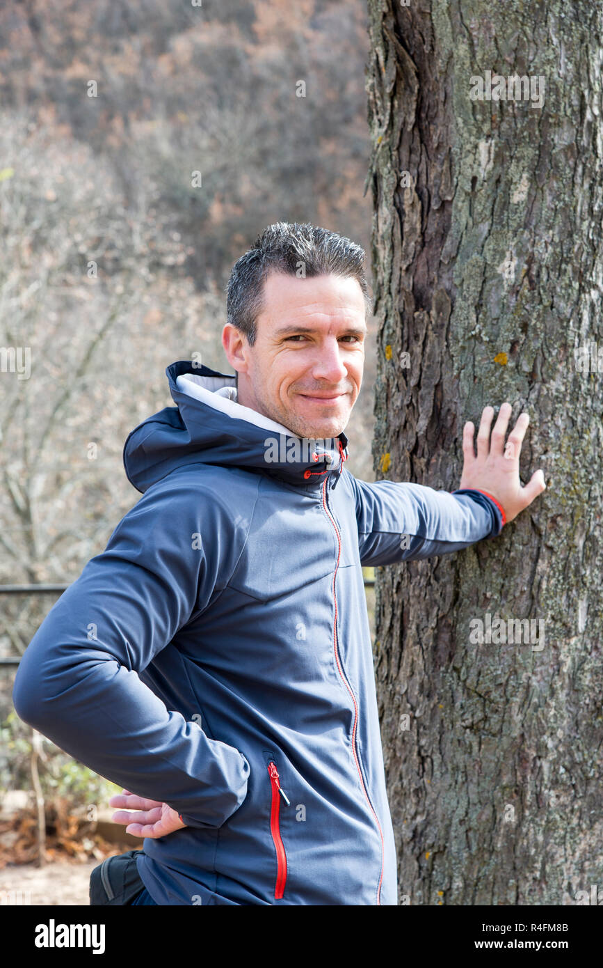 Standing besides the tree hi-res stock photography and images - Alamy