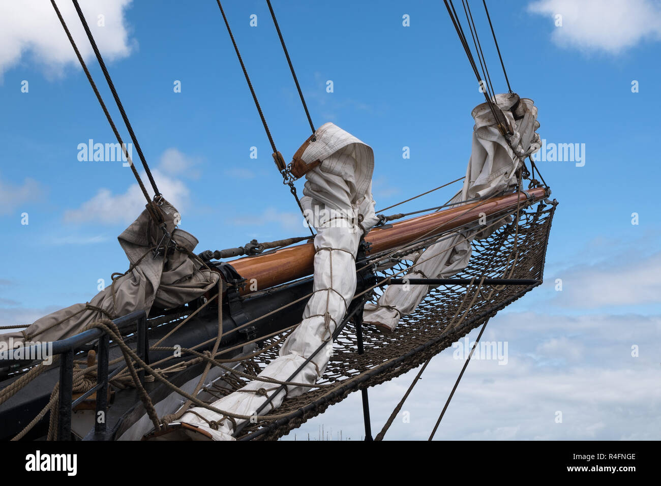 bowsprit and jib boom with reefed sails on the bow of a historic ...