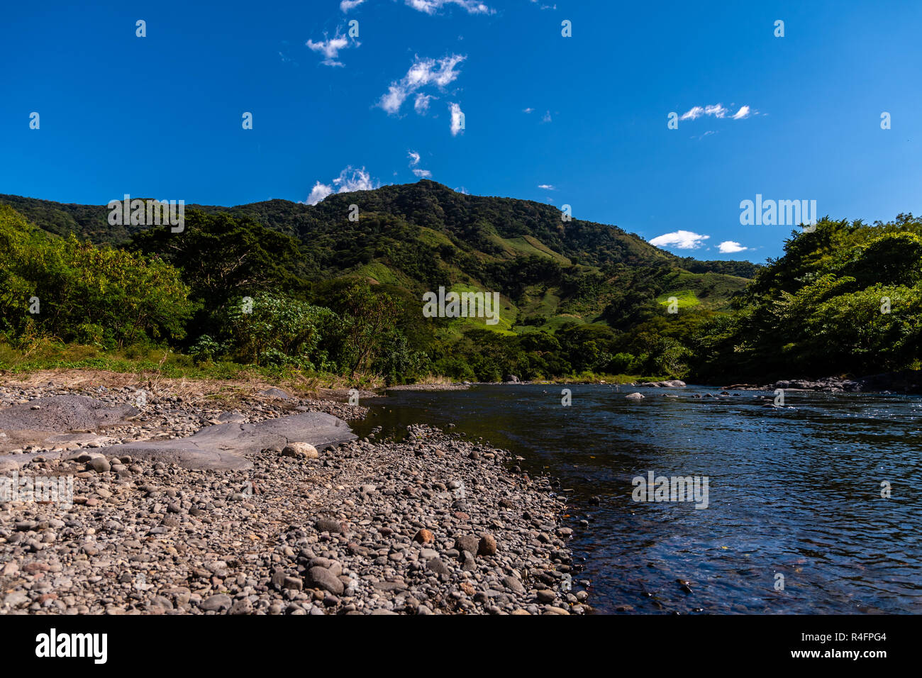 Guatemalan river and mountains Stock Photo - Alamy