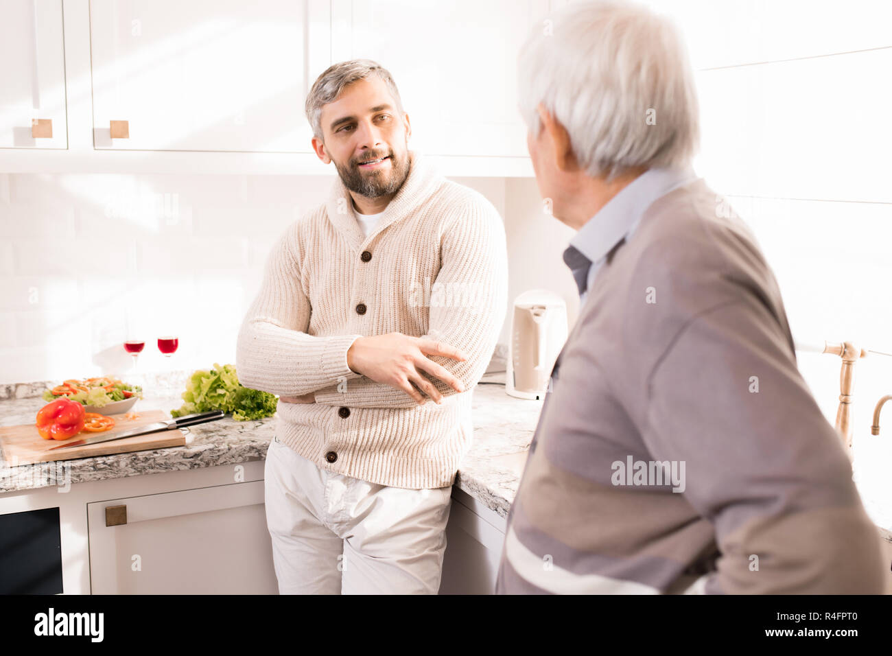 Two older men talking hi-res stock photography and images - Alamy
