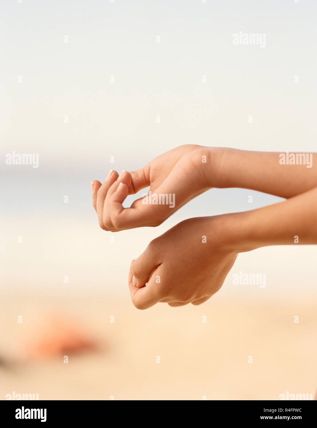 Woman holding out her hands Stock Photo - Alamy