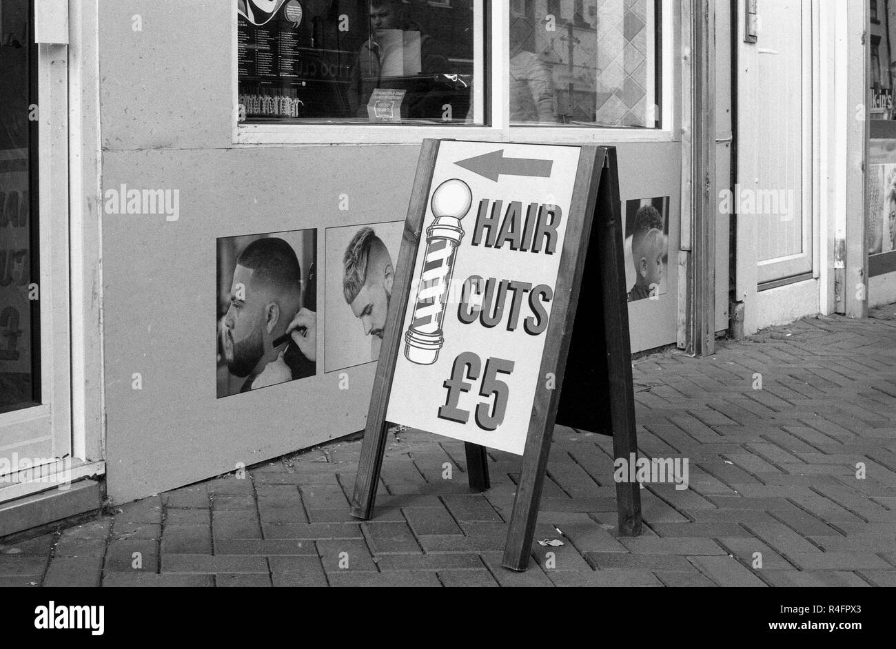 Sign outside a barber shop hi-res stock photography and images - Alamy