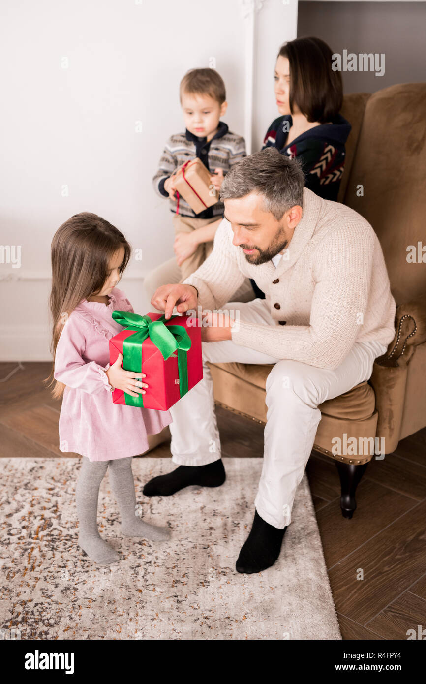 Son and daughter giving gift to father hi-res stock photography and ...