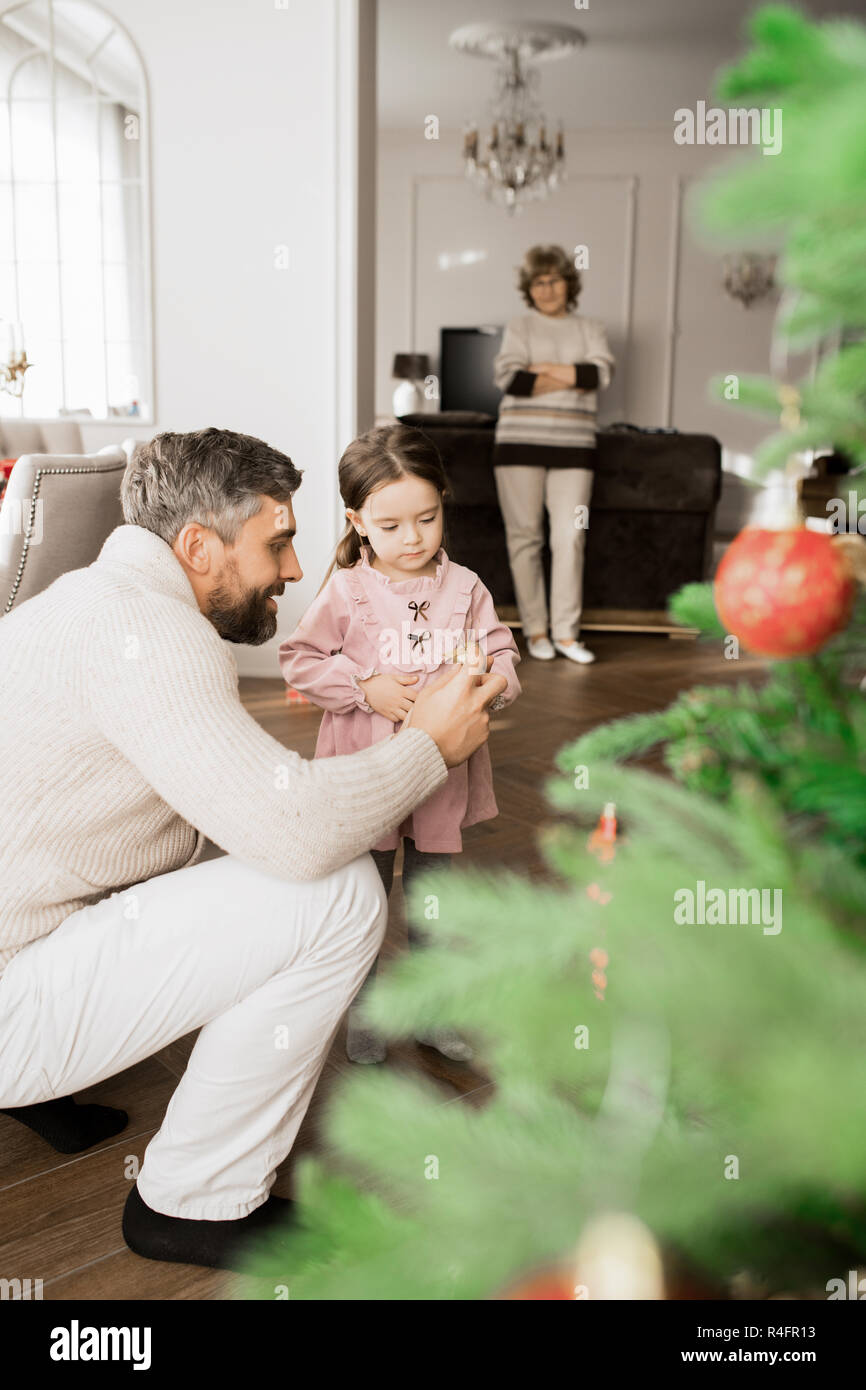 Father decorating tree hi-res stock photography and images - Alamy