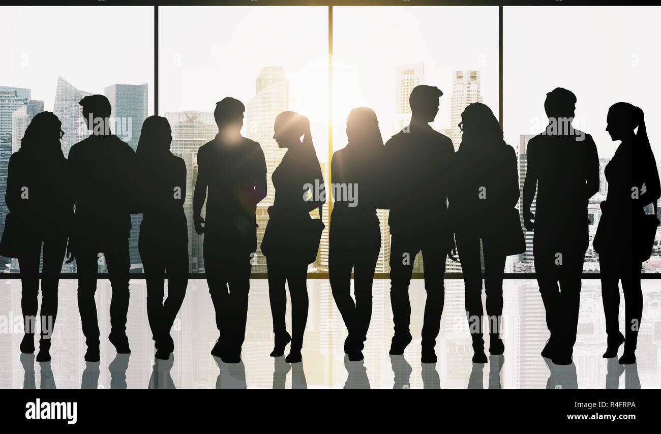 people silhouettes over window and city background Stock Photo - Alamy